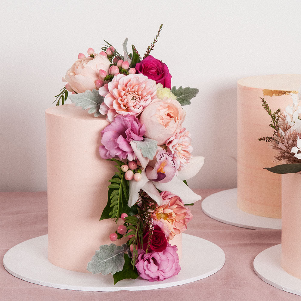 Buttercream cake with flower cascade – CakeInk